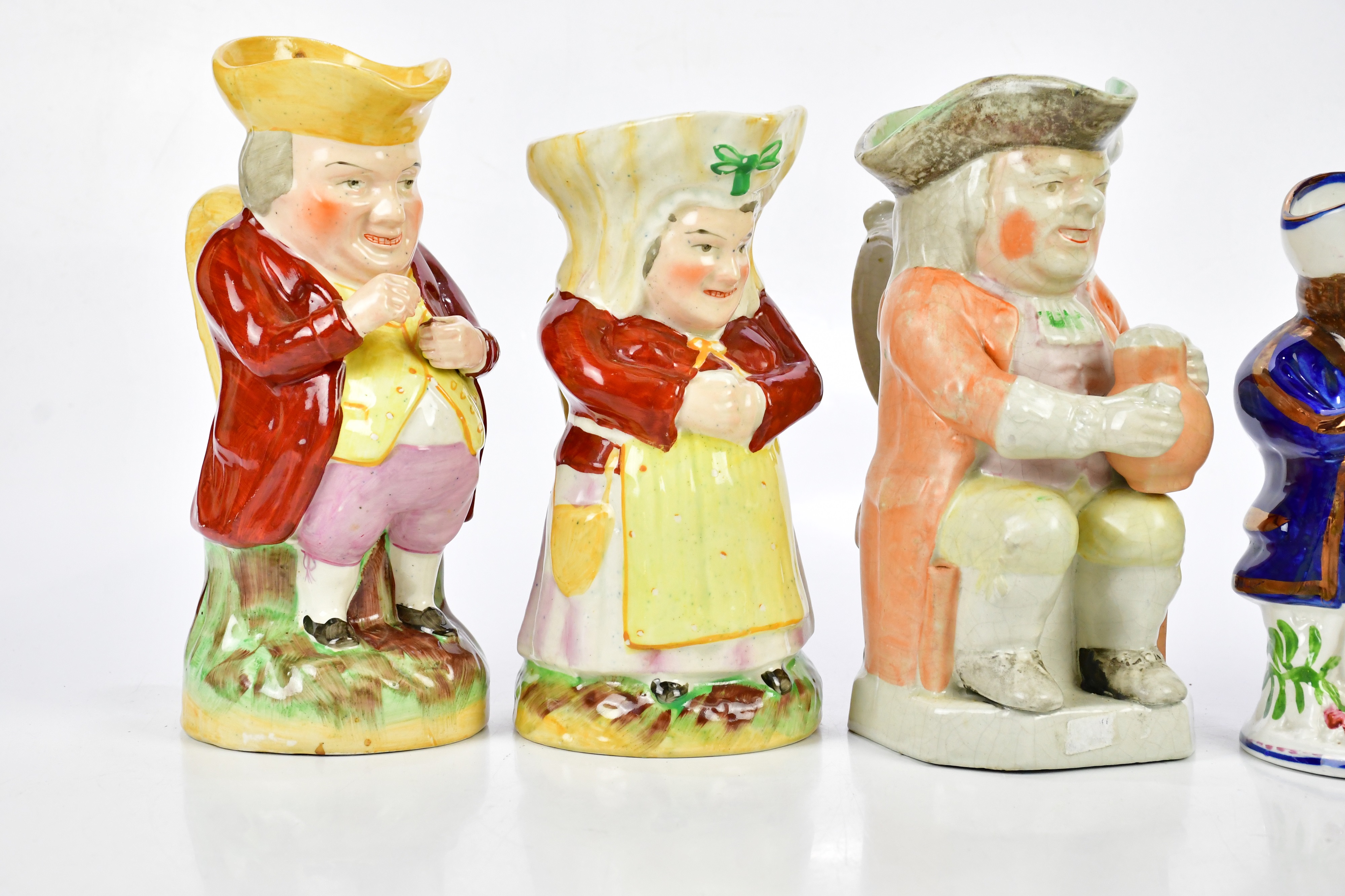 Lot 1431 - A collection of five Toby jugs, one with
