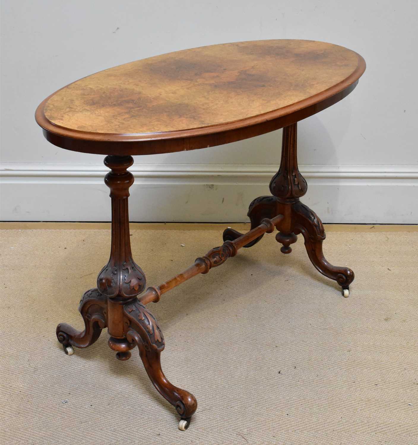 Lot 1264 - A Victorian walnut loo table with carved