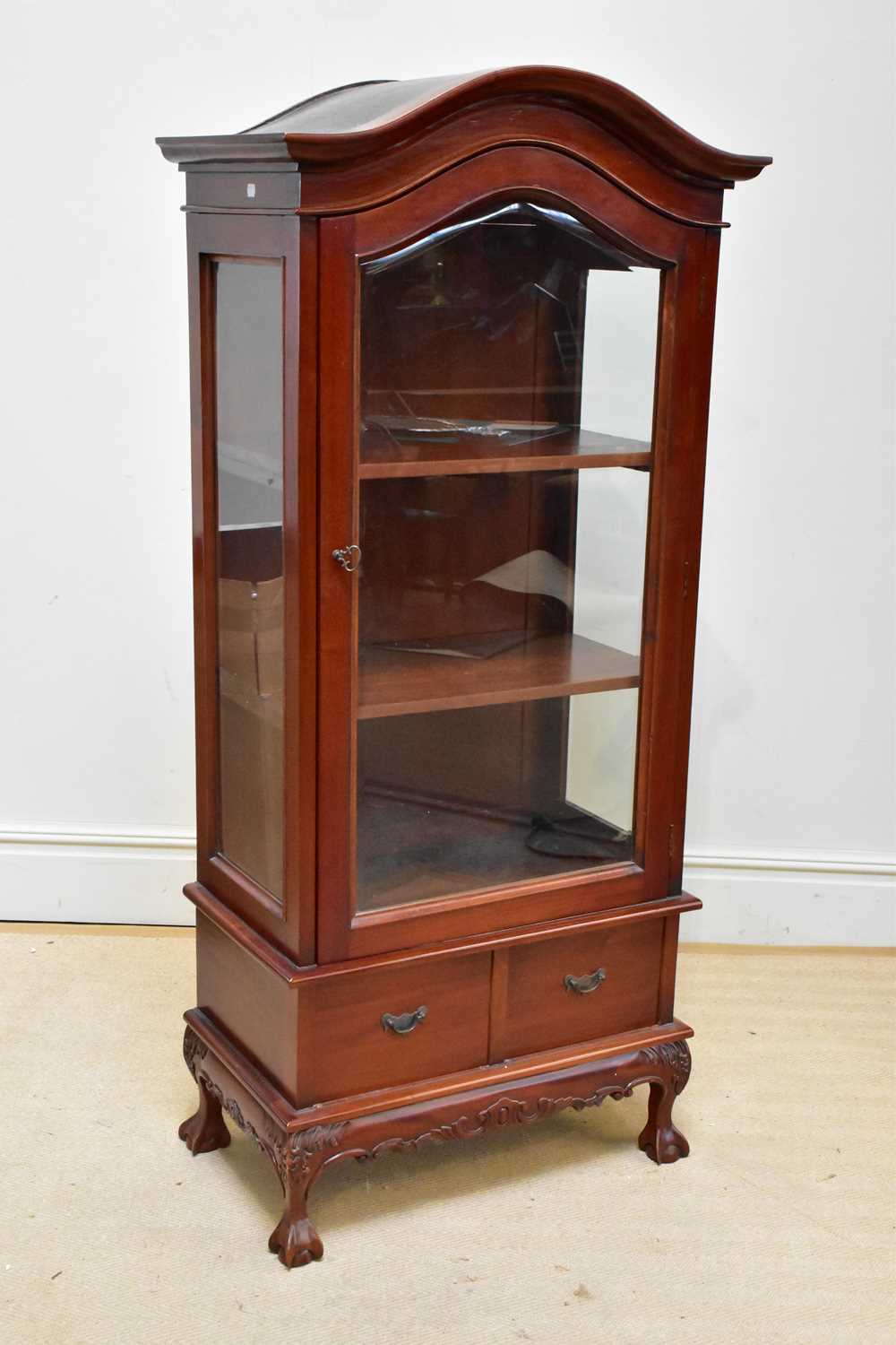 Lot 1062 - A reproduction display cabinet with arched