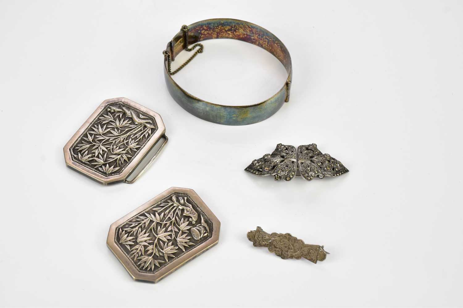 Lot 507 - A sterling silver snap bangle with chased