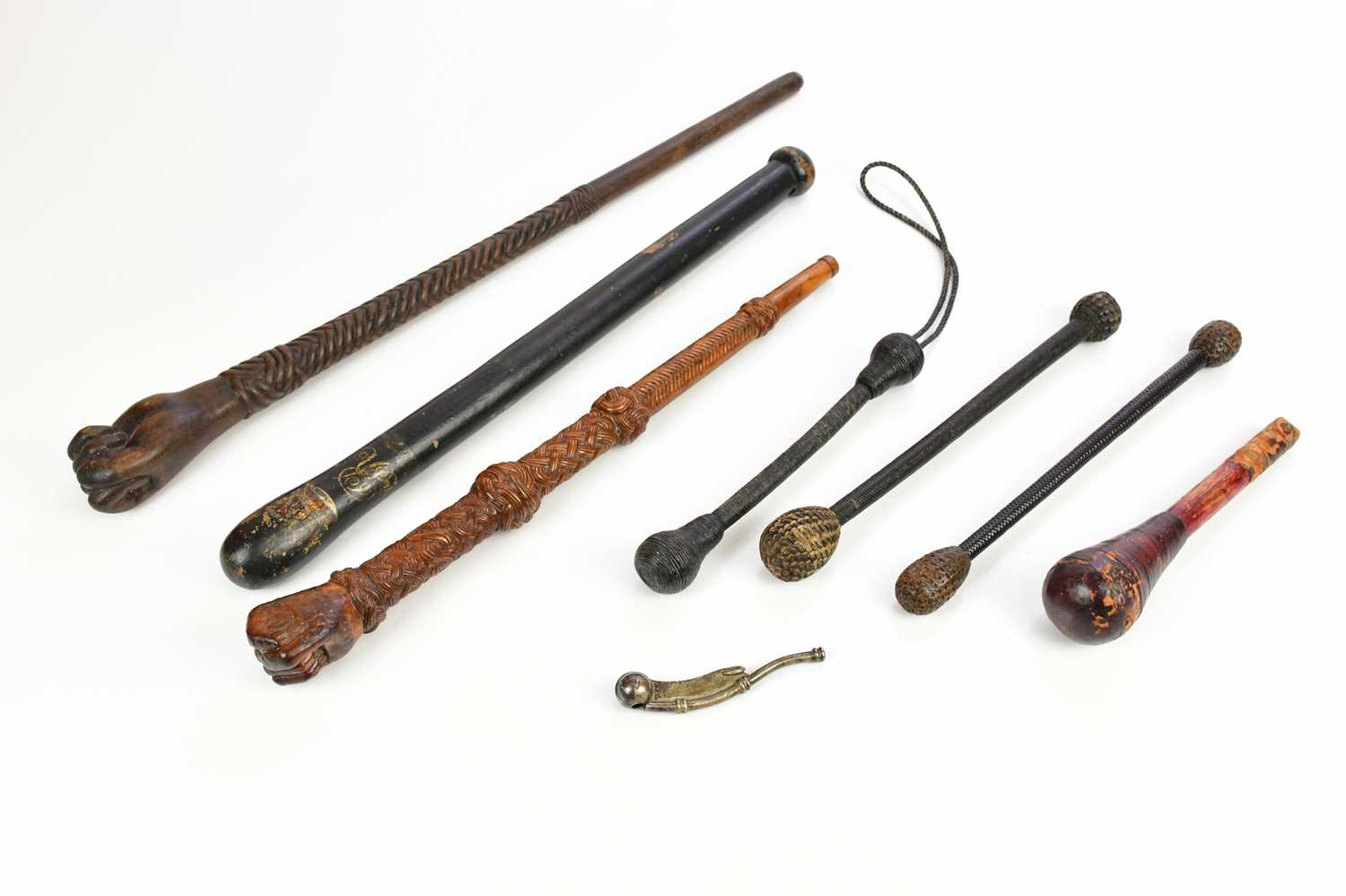 Lot 1248 - Two carved wood cosh, each with rope twist