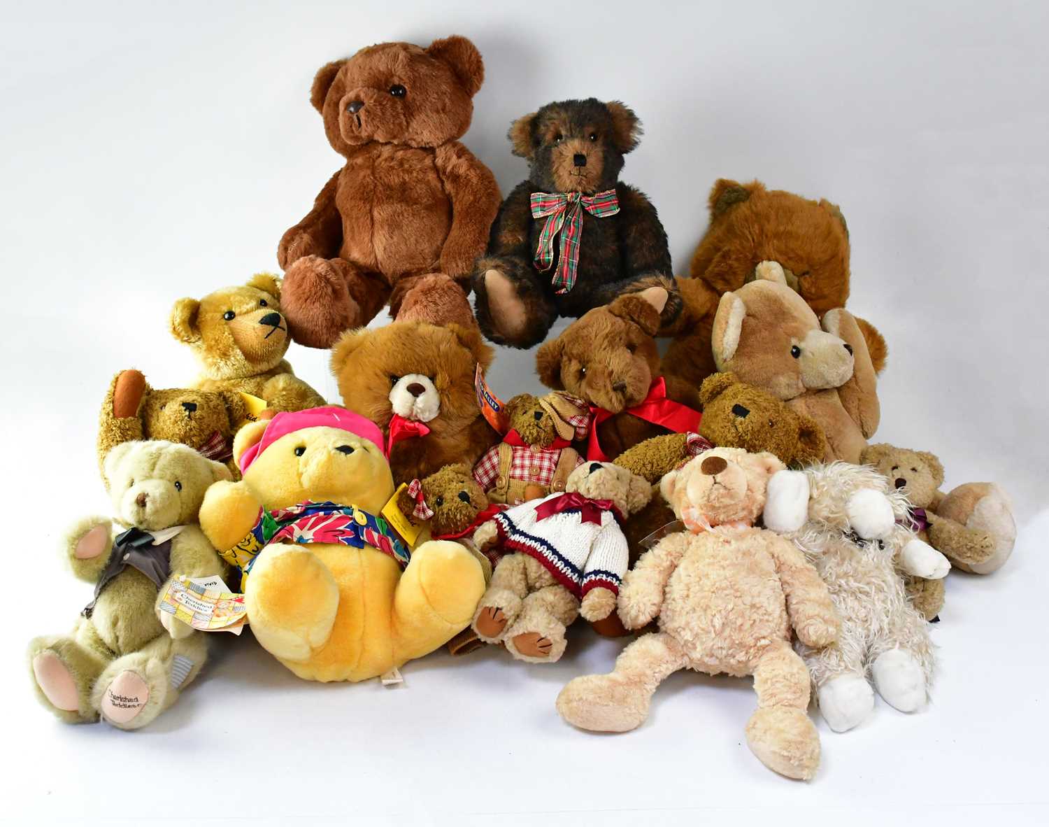 Lot 700 - A collection of teddy bears, to include