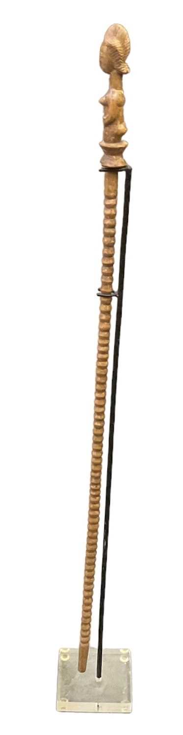 Lot 1087 - An African carved wooden baton with ribbed