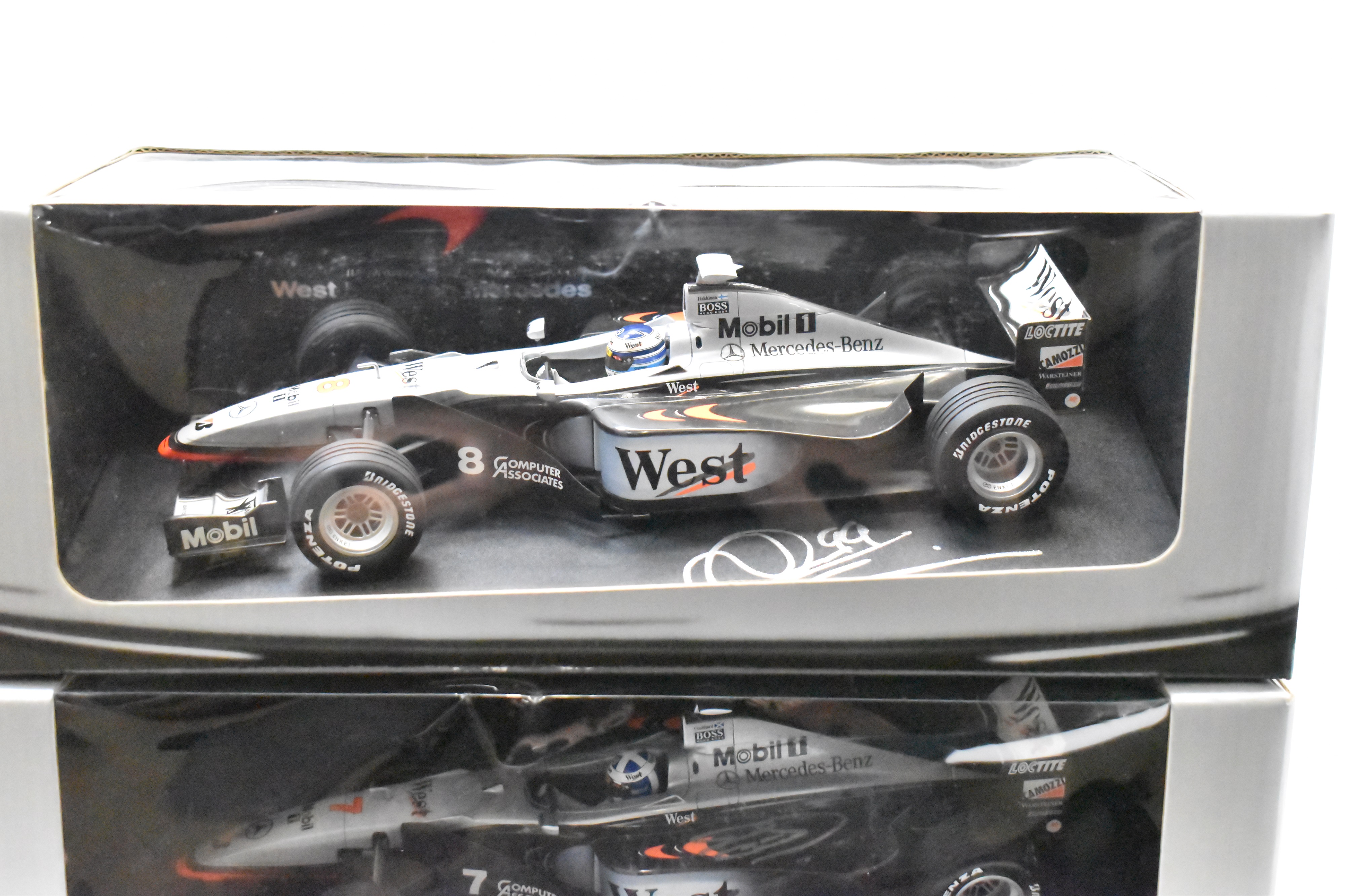 Lot 865 - WEST MCLAREN MERCEDES; two boxed Formula 1