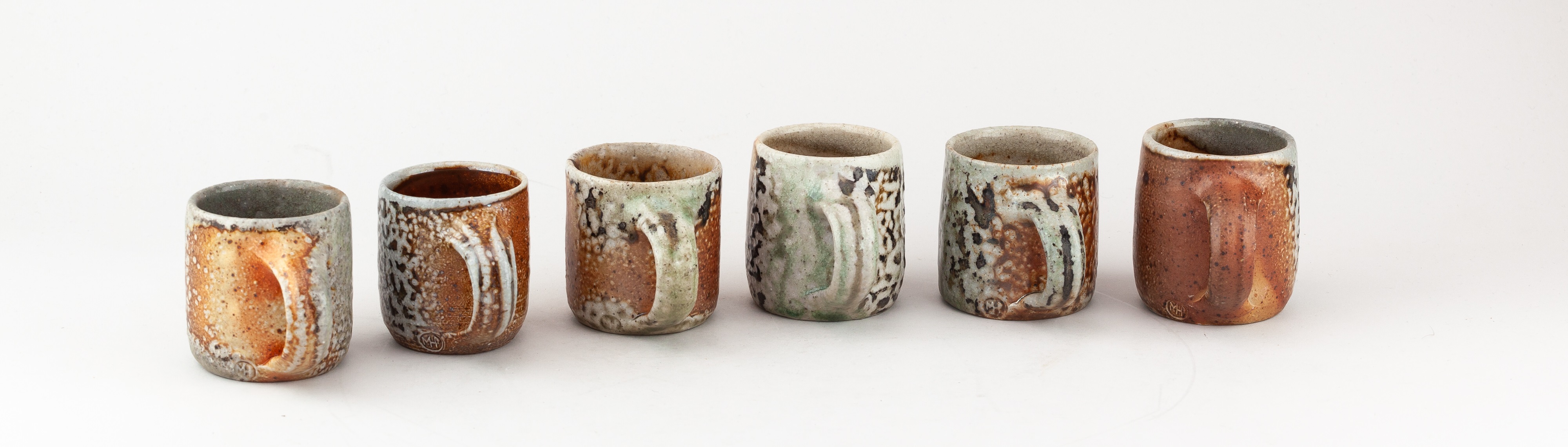 Lot 381 - Maze Hill Pottery; a set of six small