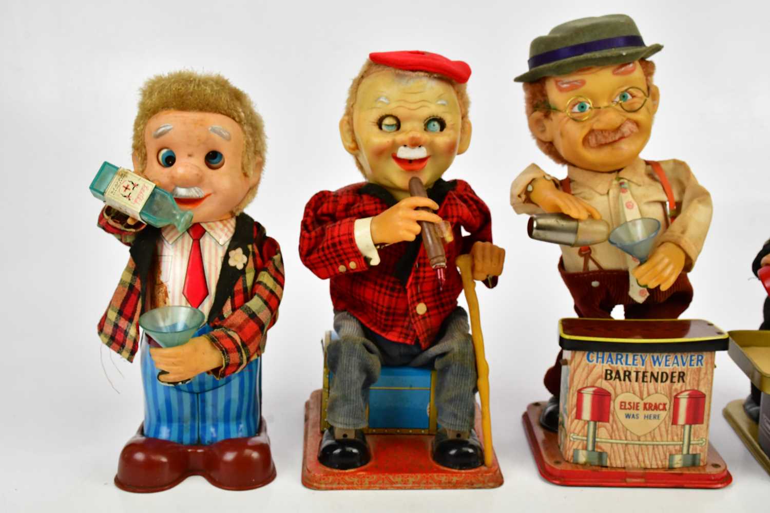 Lot 156 - Four wind-up toys including Blushing Willy,