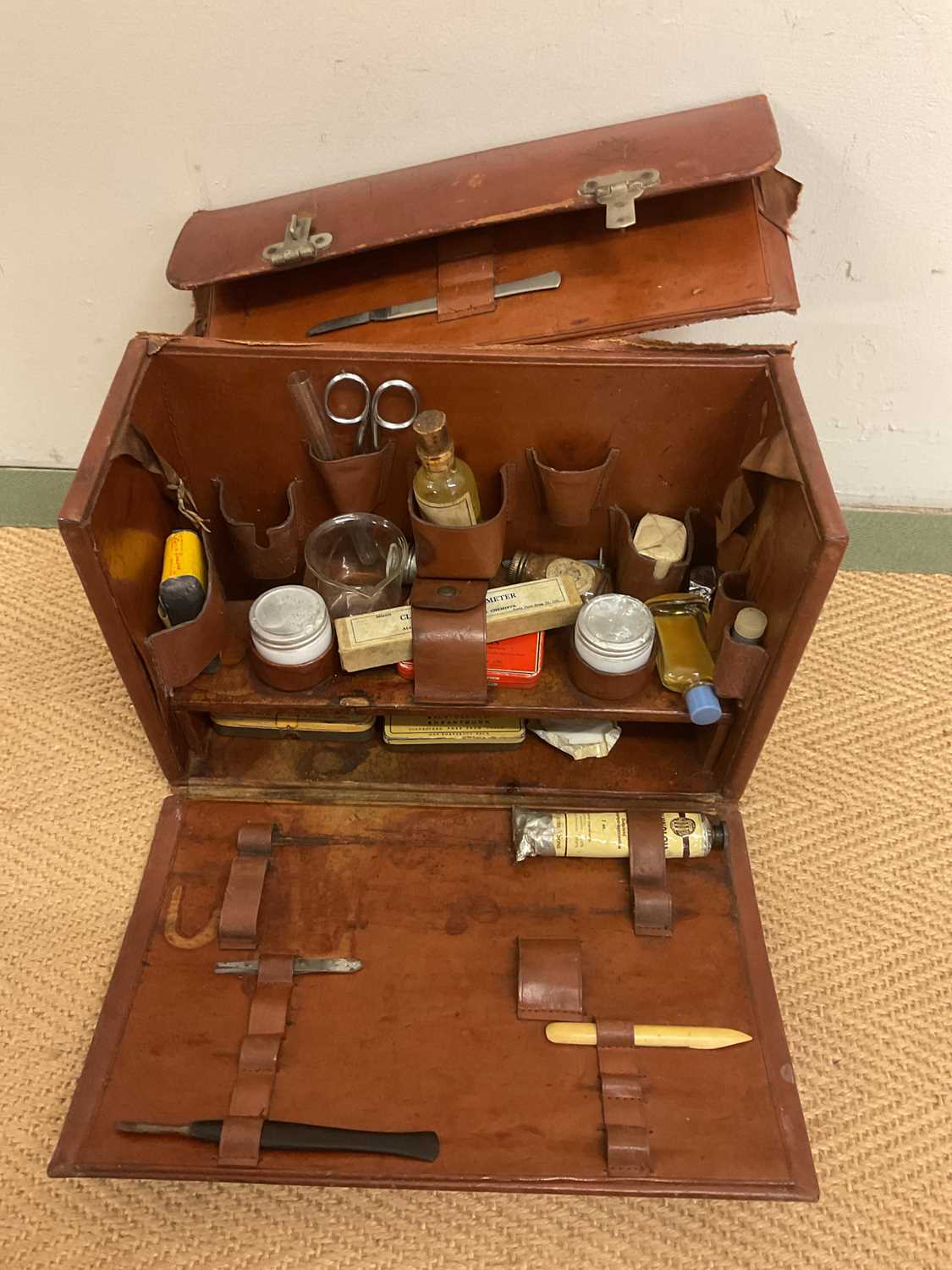 Lot 90 - A small leather medical case with some