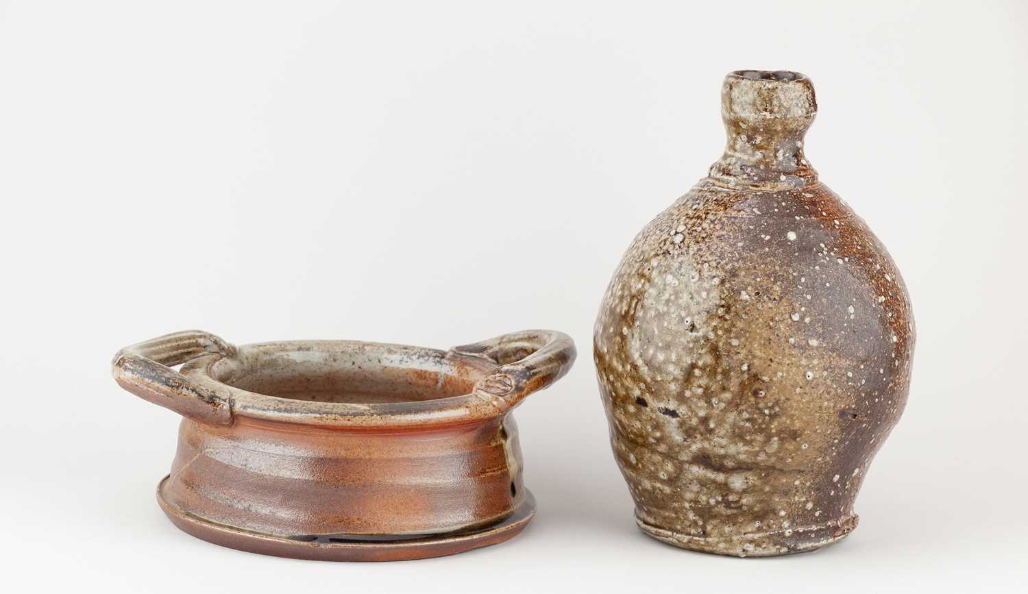 Lot 674 - A wood fired stoneware bottle covered in ash