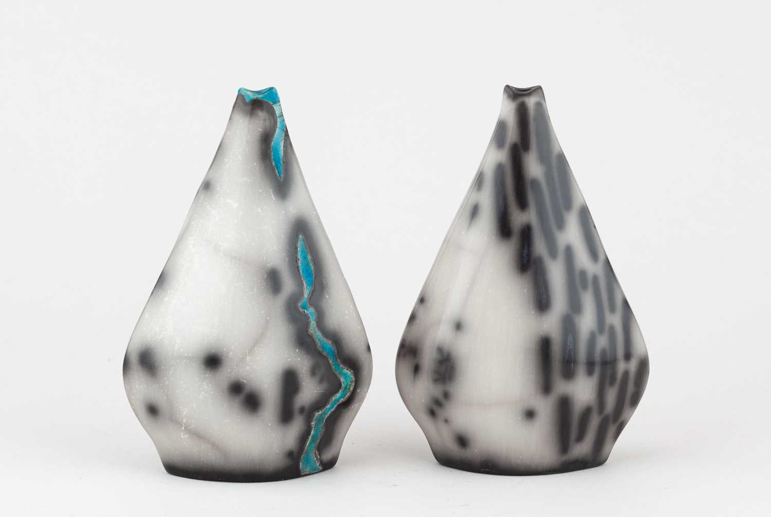 Lot 608 - SUSAN LUKER; a near pair of raku barnacle