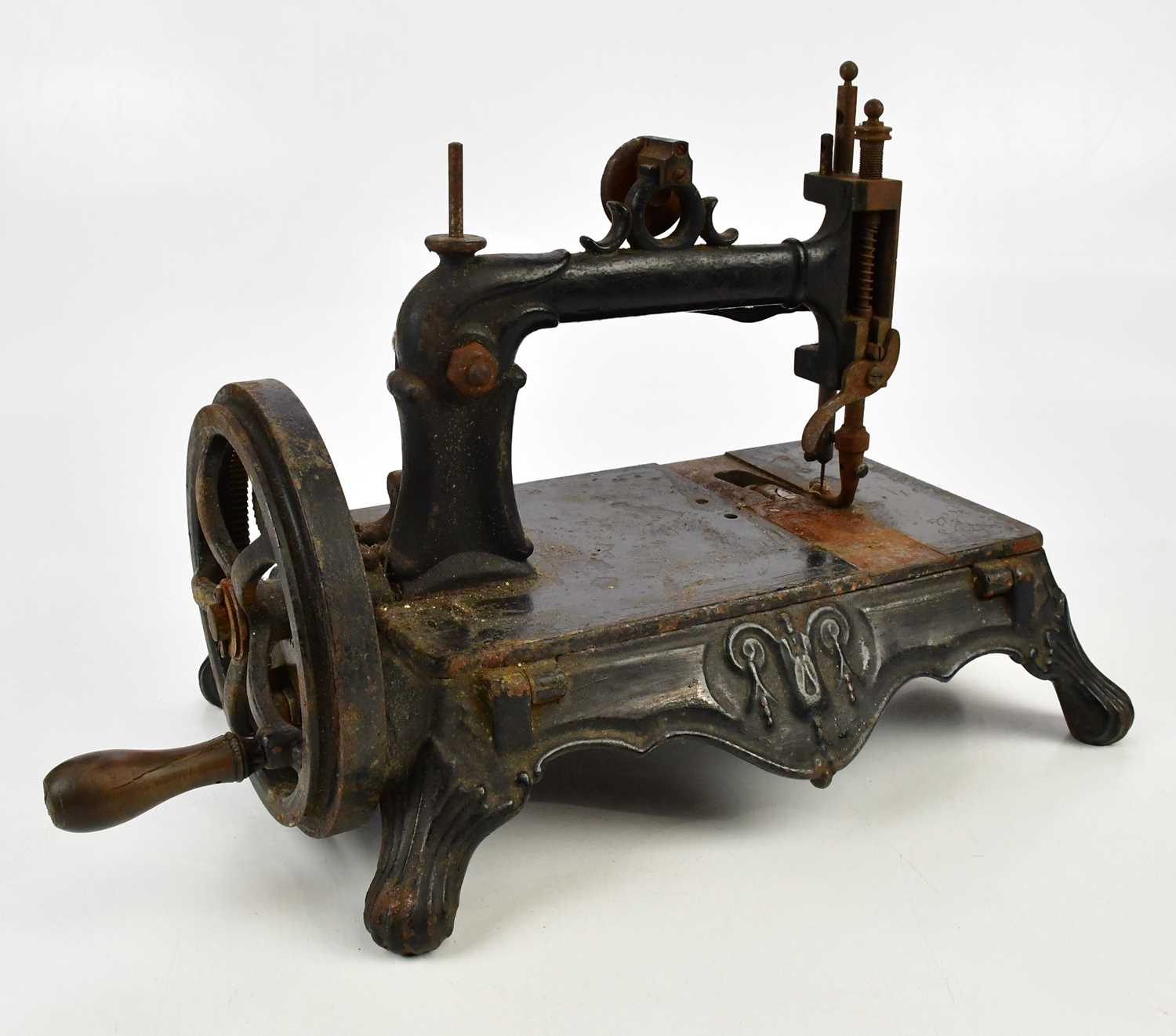 Lot 1688 - A 19th century cast iron sewing machine.