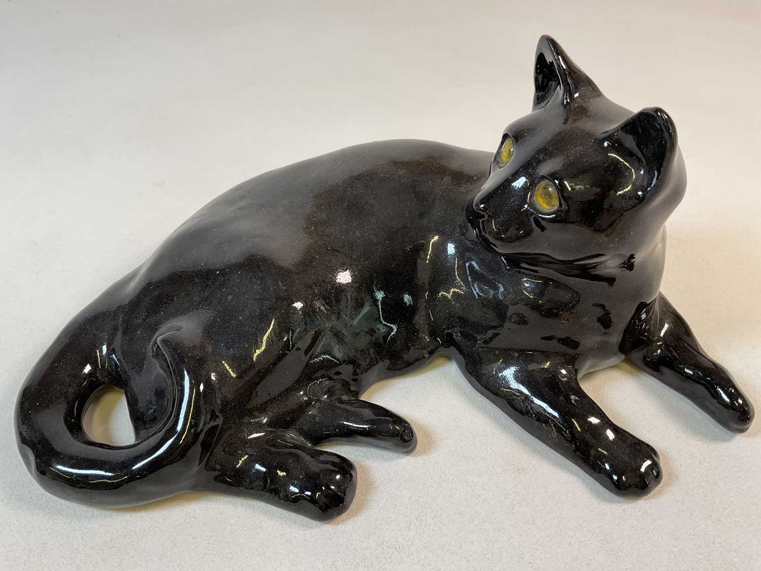 Lot 312 - WINSTANLEY; a large recumbent black cat with