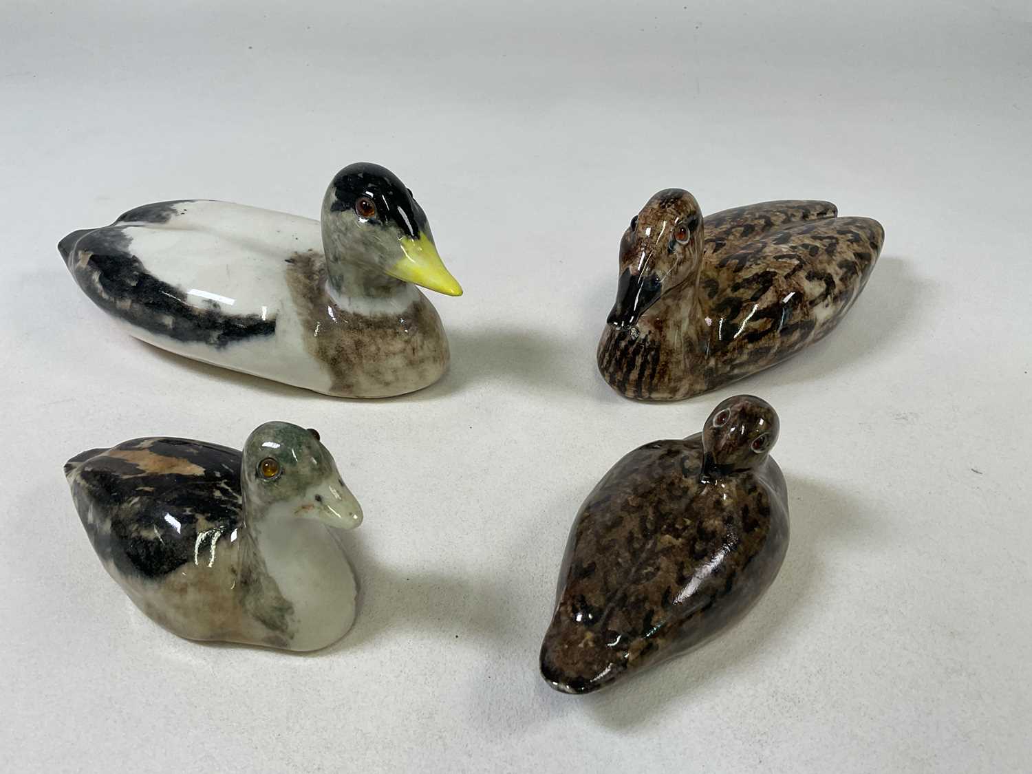 Lot 314 - WINSTANLEY; a group of four ducks including