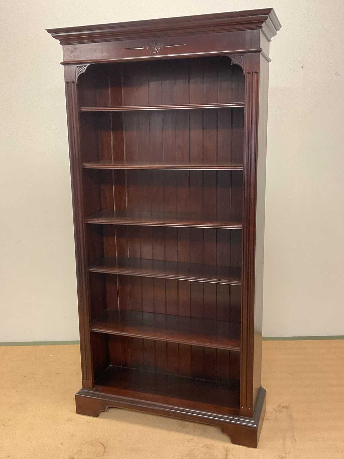 Lot 749 - A reproduction dark wood bookcase with five