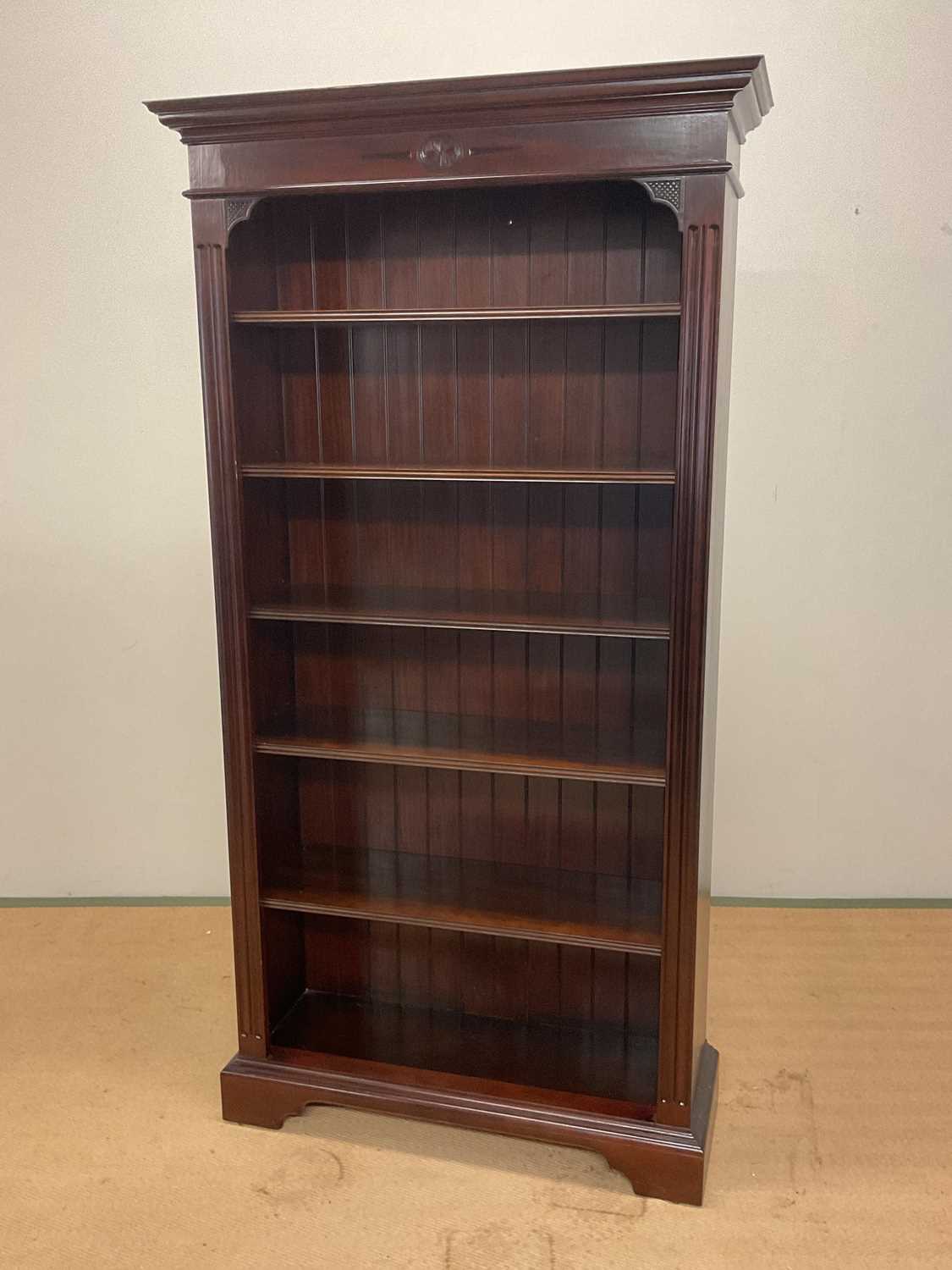 Lot 750 - A reproduction dark wood bookcase with five