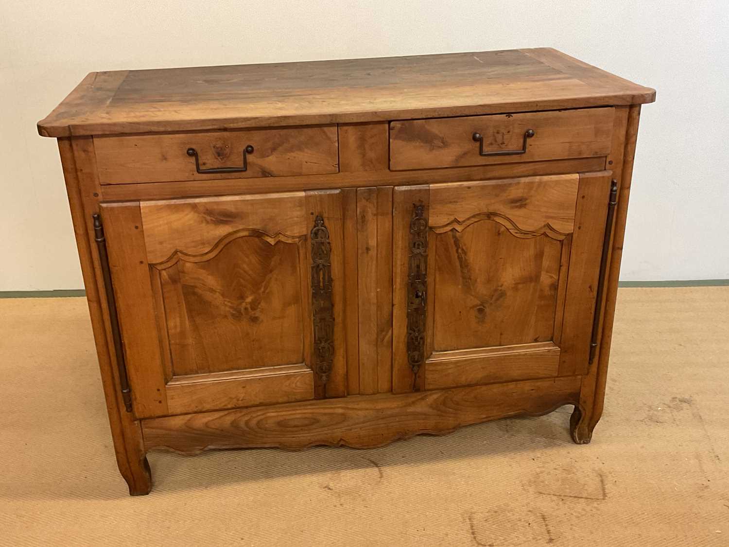 Lot 747 - A rustic pine sideboard, with scrolled
