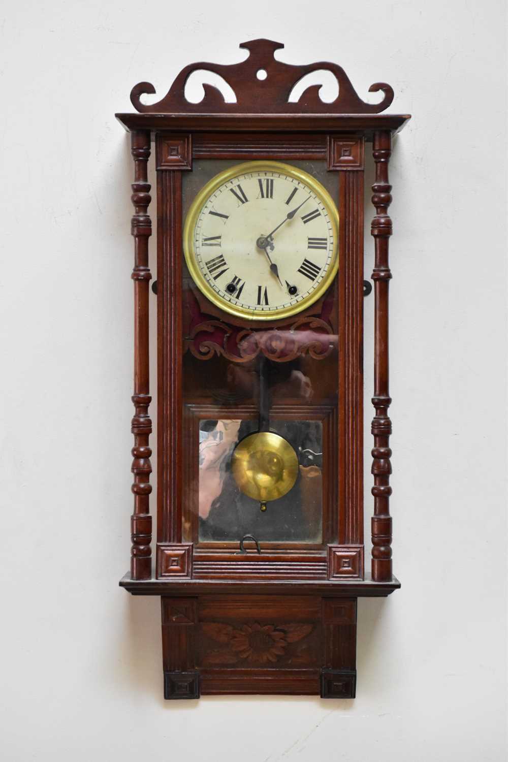 Lot 1421 - An early 20th century American wall clock,