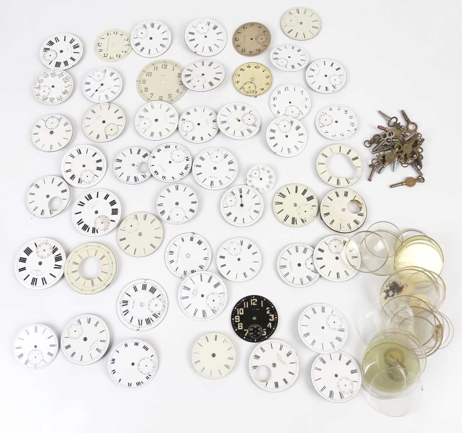 Lot 688 - A collection of various pocket watch faces,