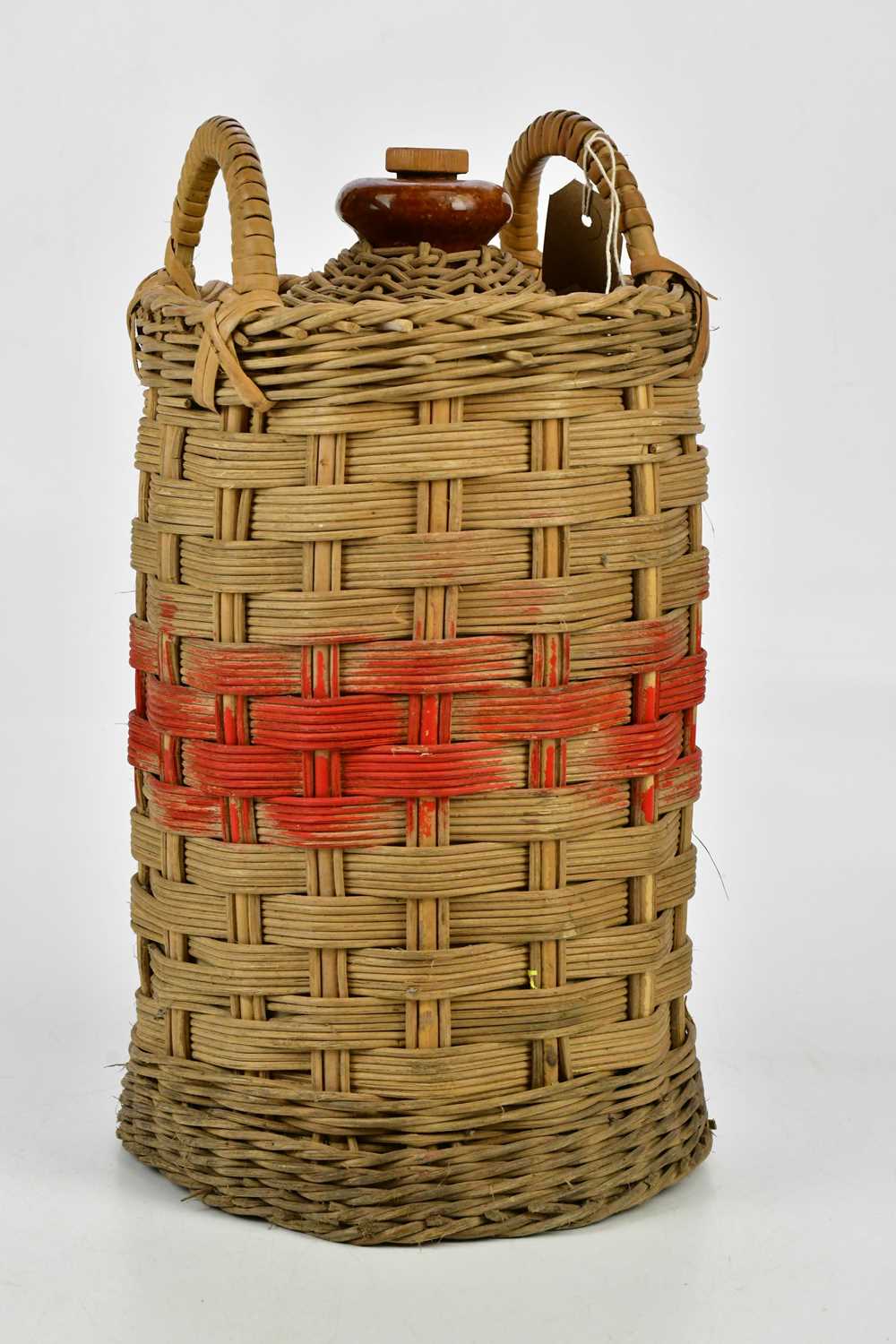 Lot 1409 - A naval rum flagon in wicker casing, height