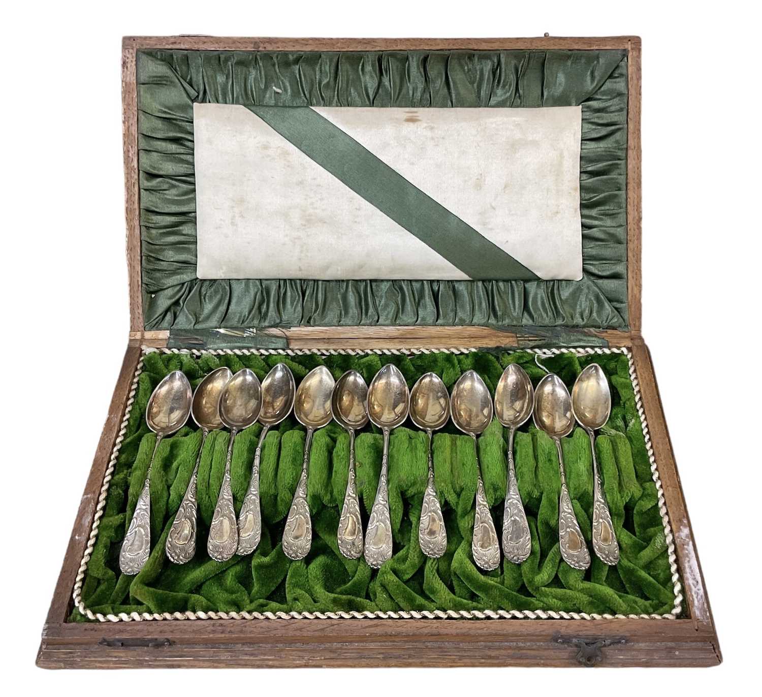 Lot 653 - An oak cased set of twelve 800 grade silver