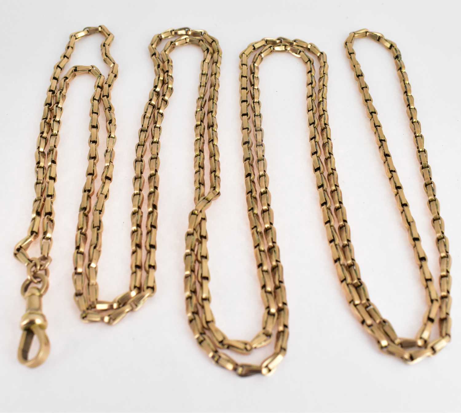 Lot 842 - A 9ct gold fancy link muff chain