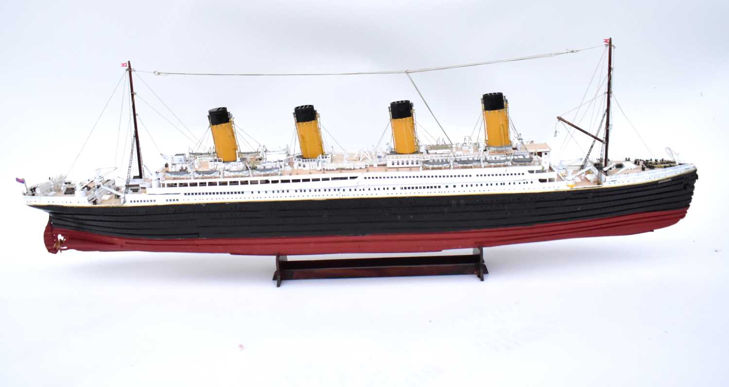 Lot 252 - RMS TITANIC; a wooden model with four
