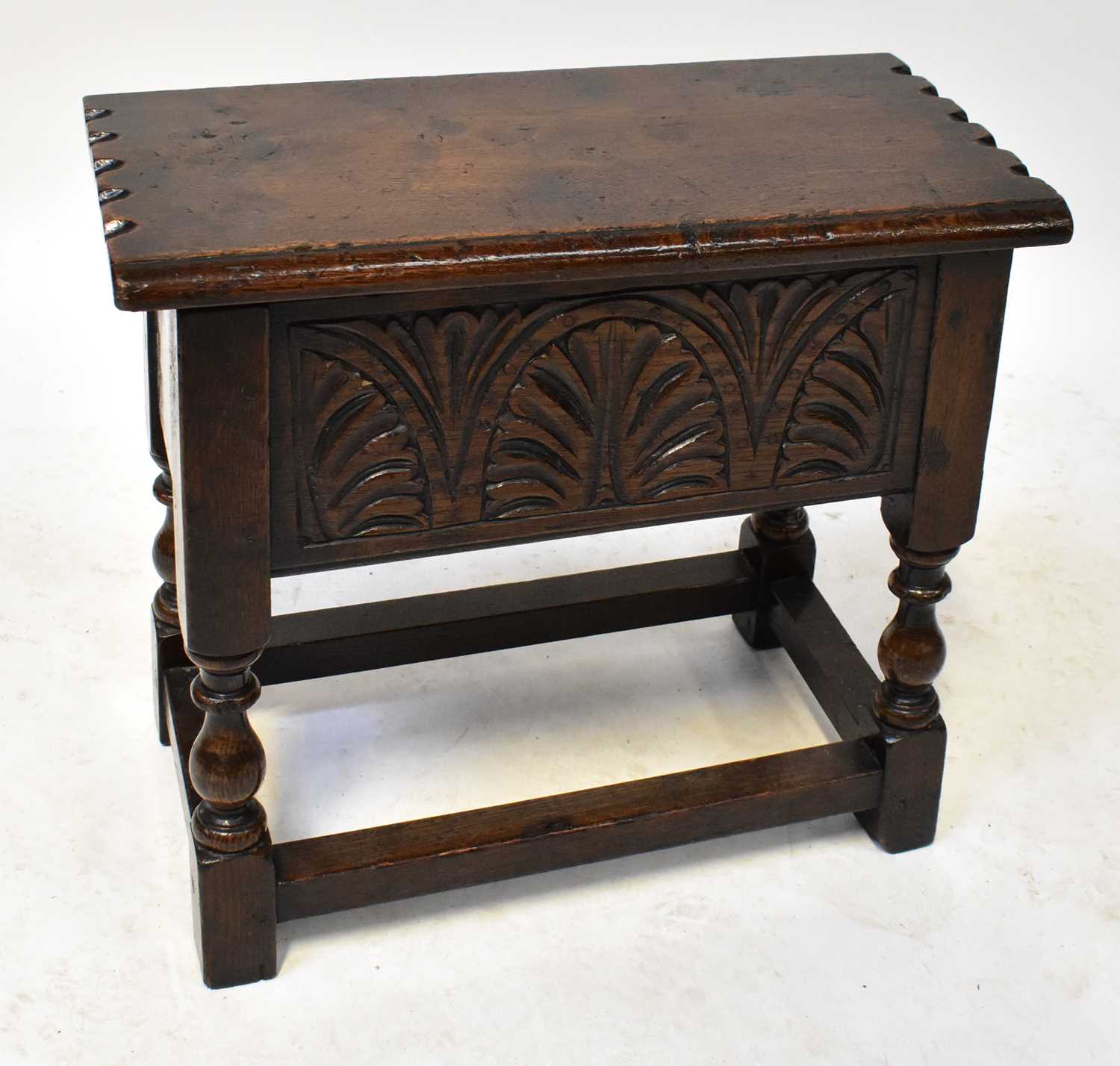 Lot 77 - A Georgian oak joint stool with lift-up lid,