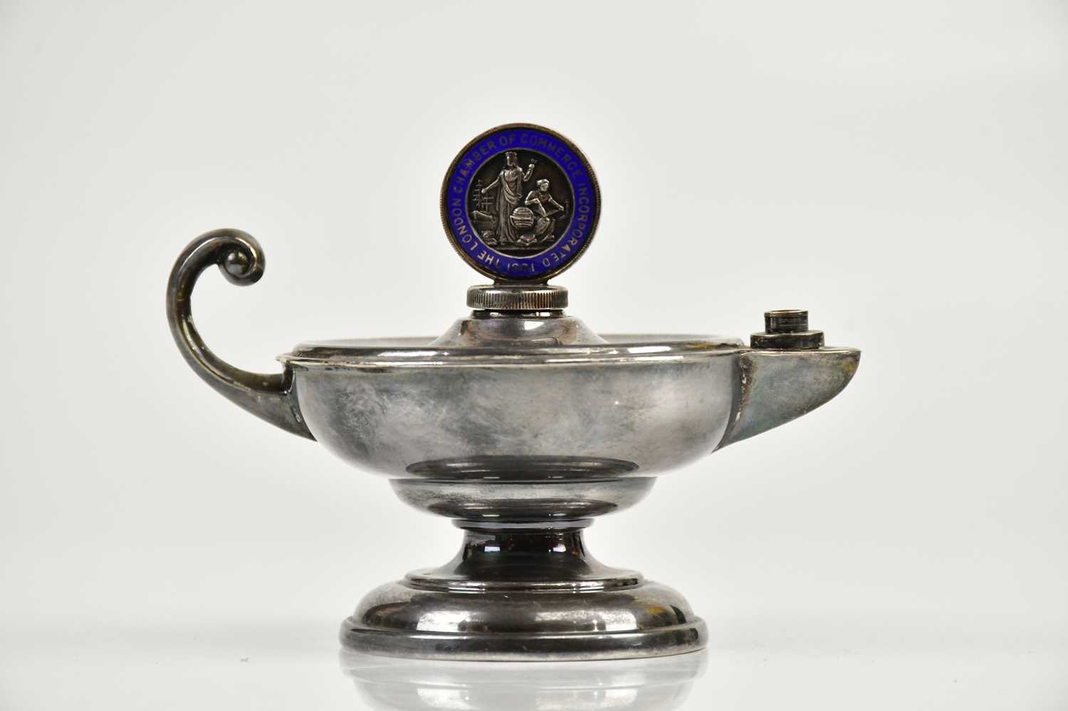 Lot 2155 - A white metal table lighter, the wick with