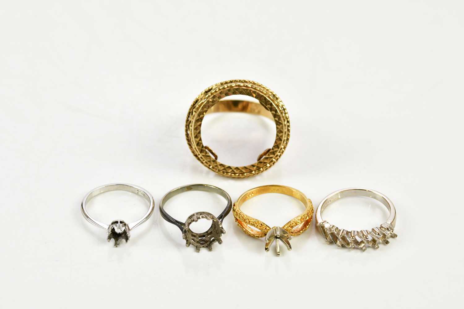 Lot 77 - Two white metal ring shanks and a similar