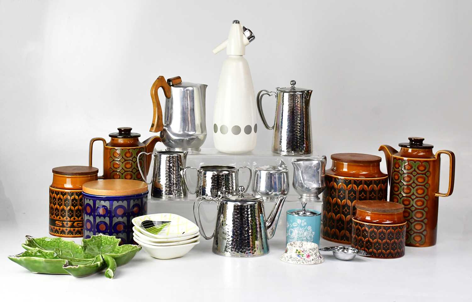 Lot 344 - A Picquot Ware teapot, milk jug and sugar