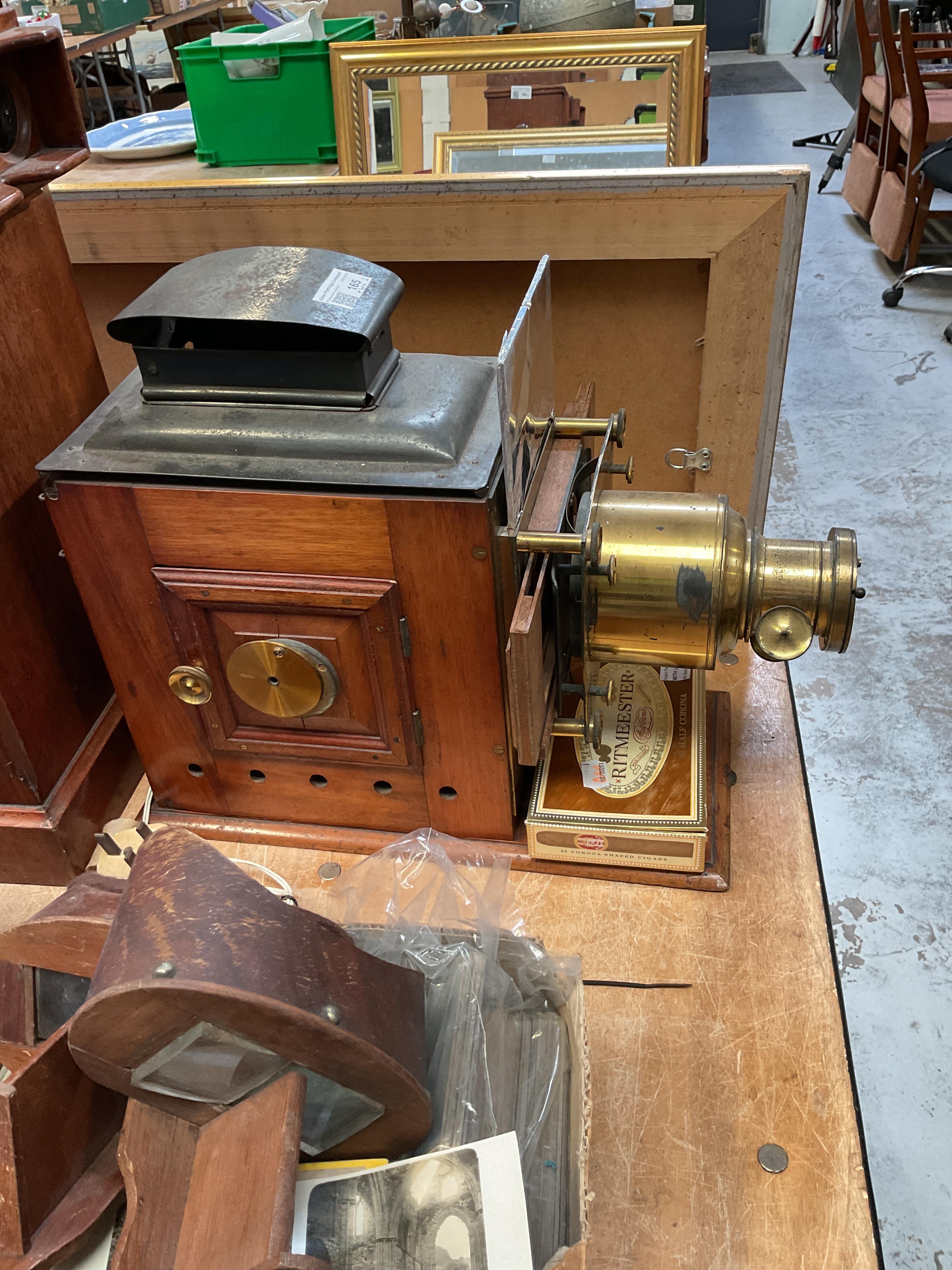 Lot 165 - A mahogany cased magic lantern with brass