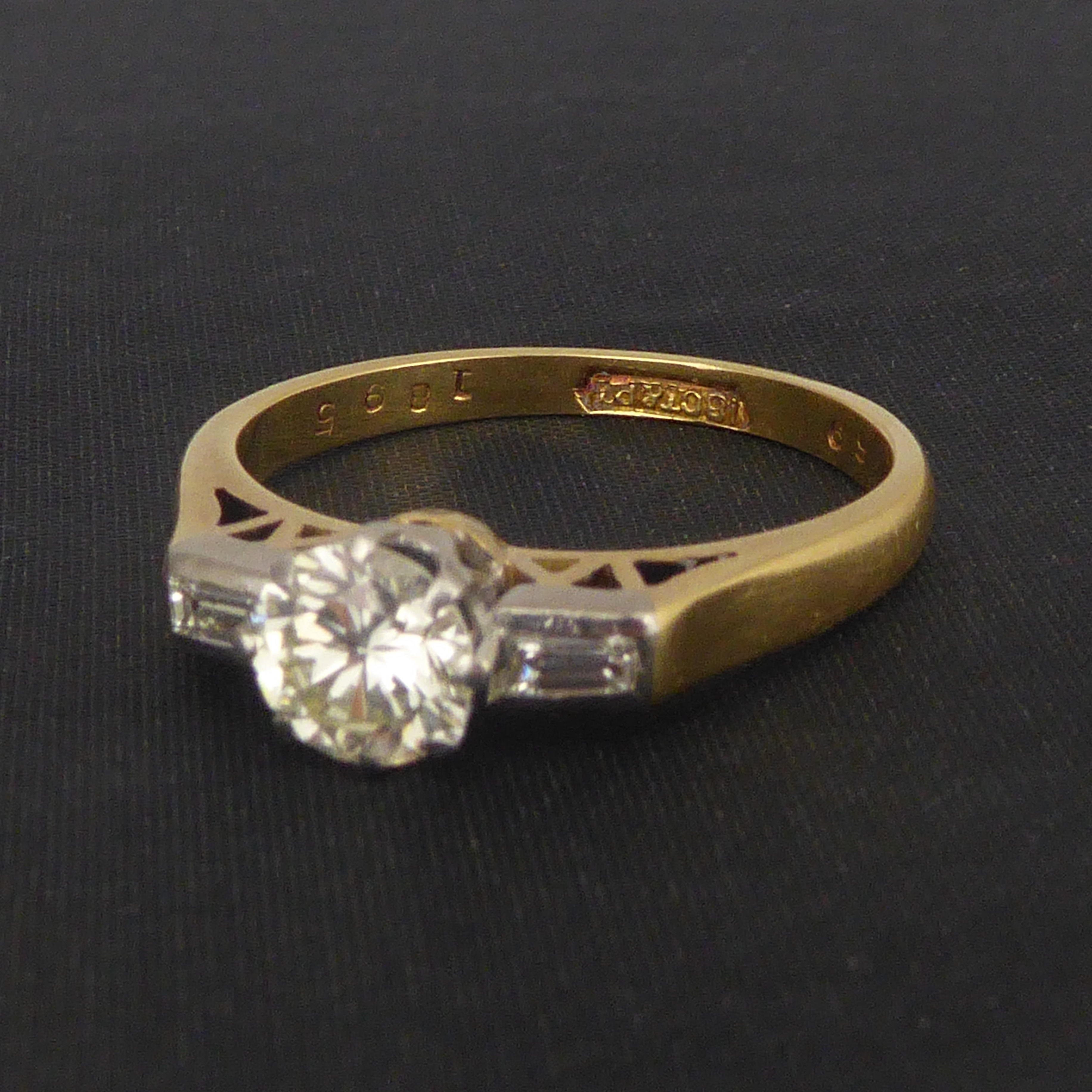 Lot 720 - An 18ct gold diamond ring, the principal
