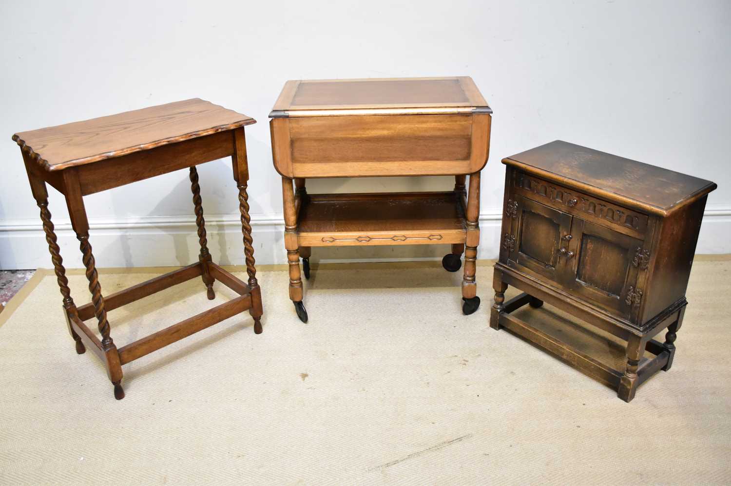 Lot 80 - A reproduction oak trolley, 76 x 65 x 42cm, a