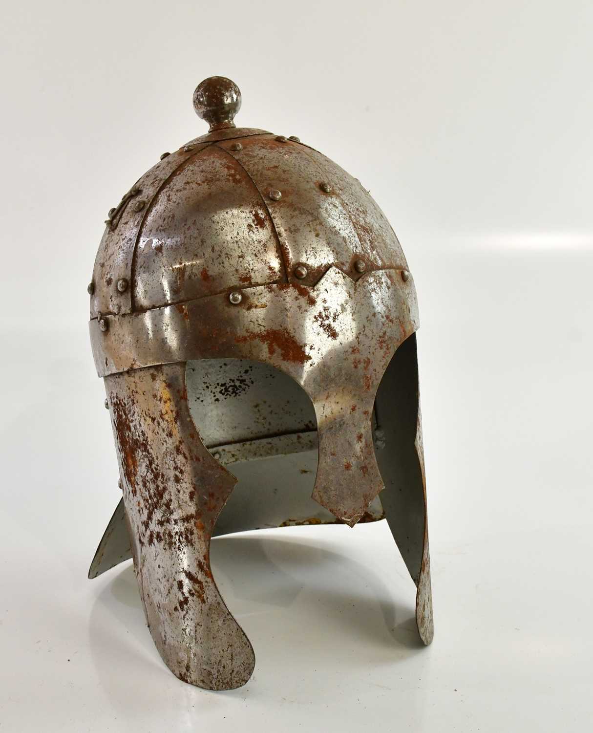 Lot 1258 - A reproduction steel medieval style helmet,