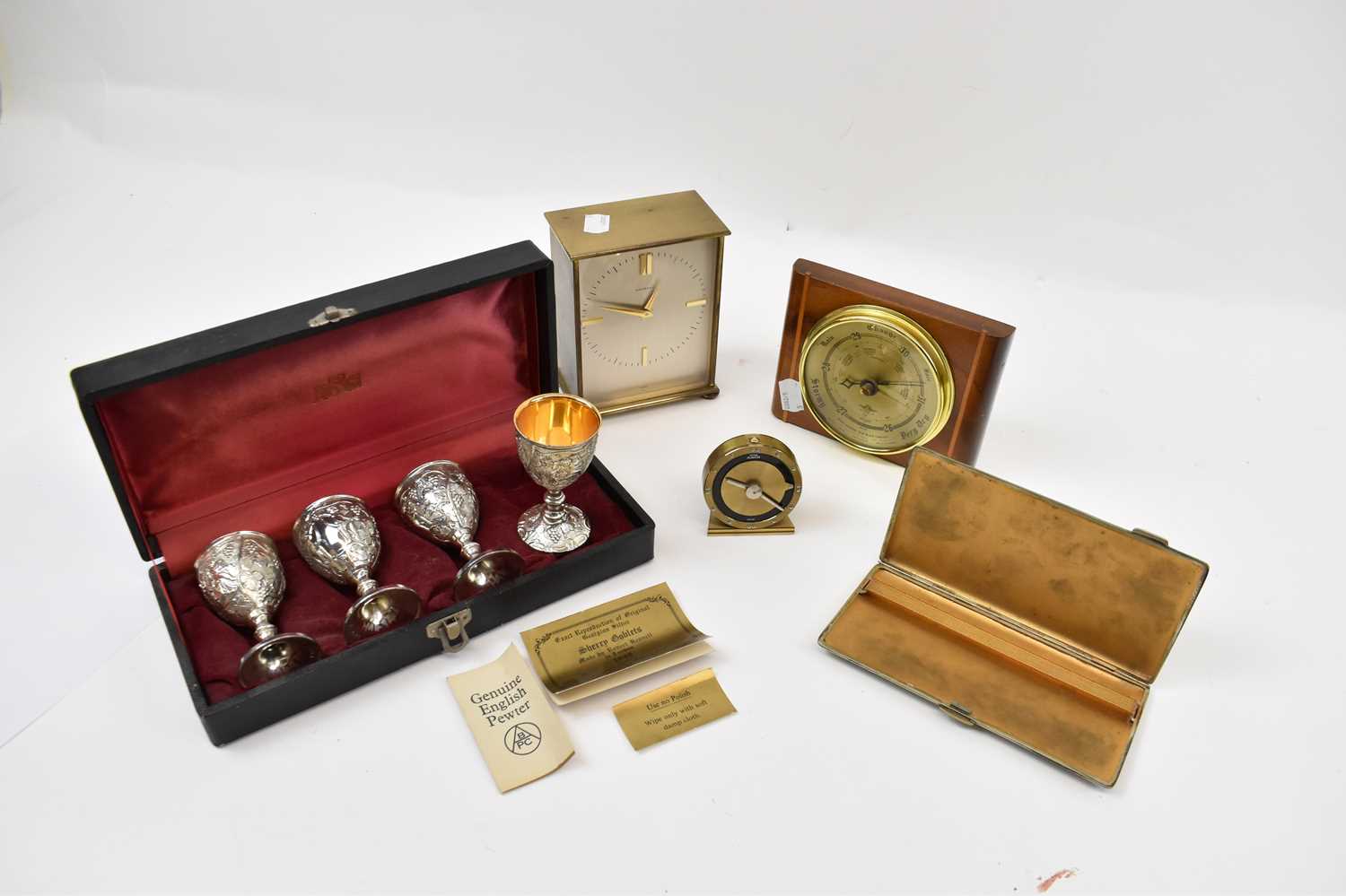 Lot 354 - A Garrard clock, a cased set of four pewter