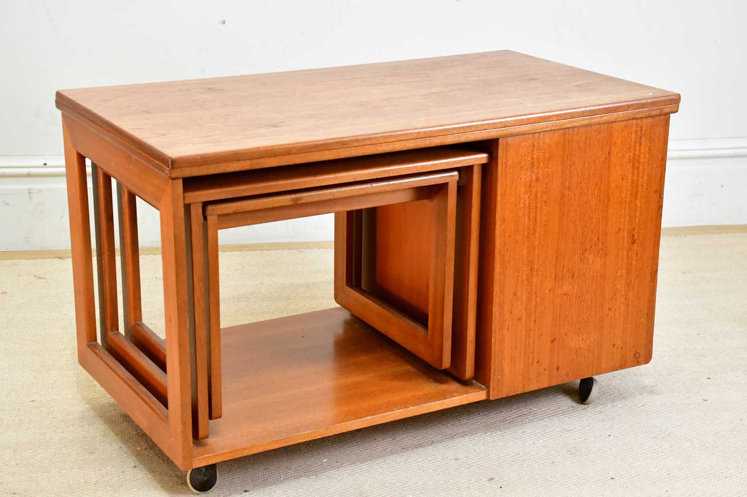 Lot 63 - TRISTOR; a mid century teak coffee table,