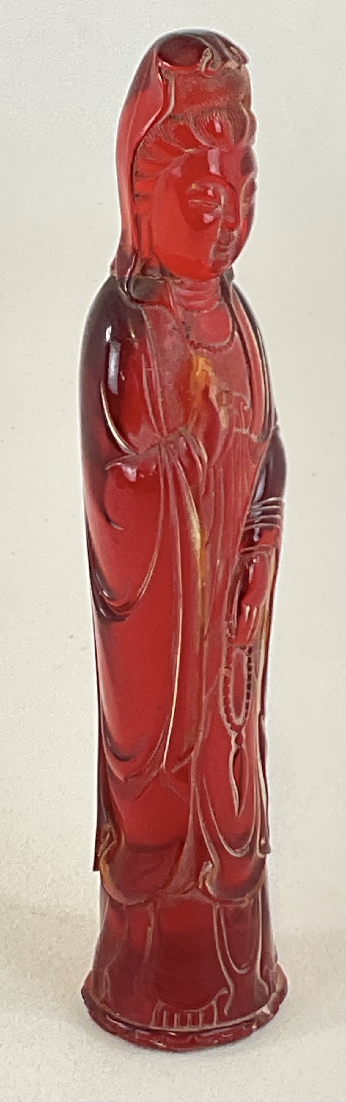 Lot 364 - A Chinese cherry amber coloured figure of
