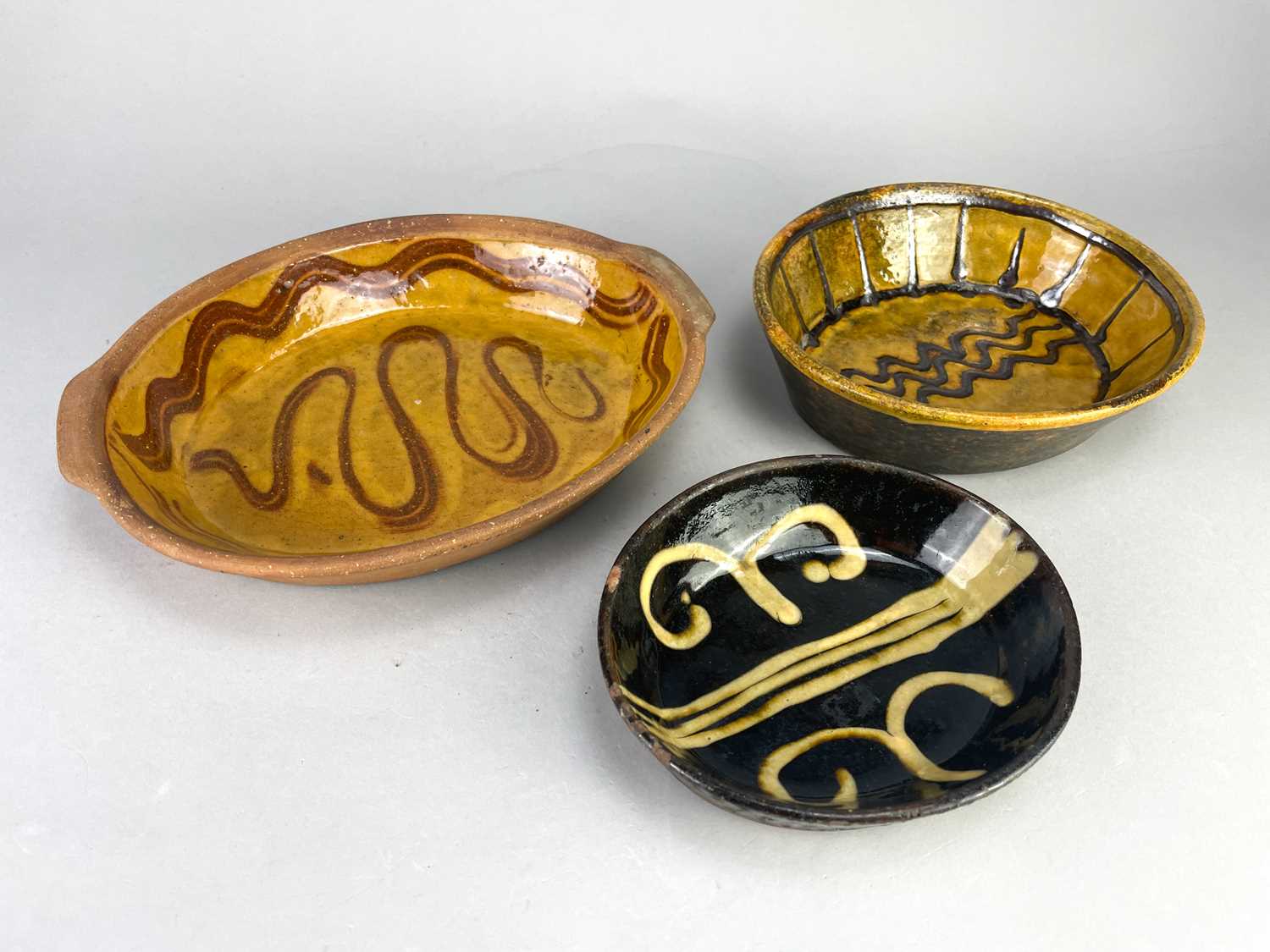 Lot 475 - Winchcombe Pottery; a trio of early oval